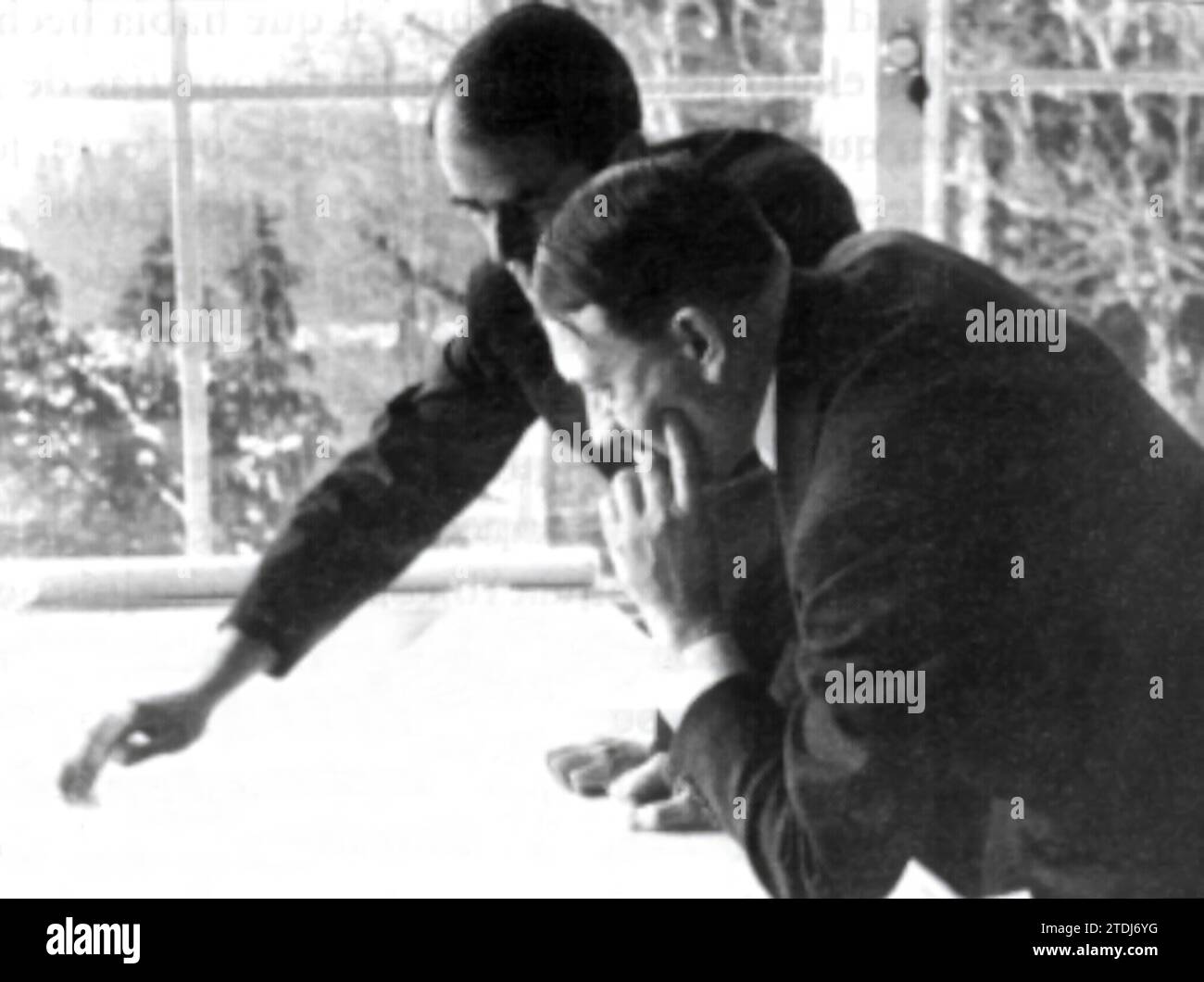 12/31/1939. Albert Speer with Hitler looking at some plans in the ...