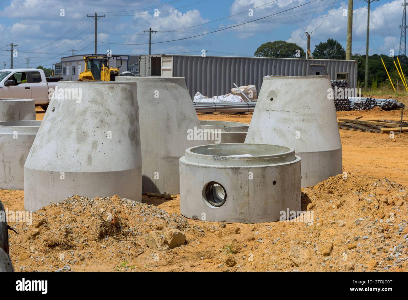 Stacked concrete drainage sewage storm water manhole at construction ...