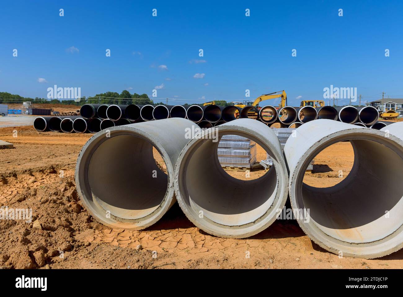Concrete drainage sewage storm water pipes are stacked at construction ...