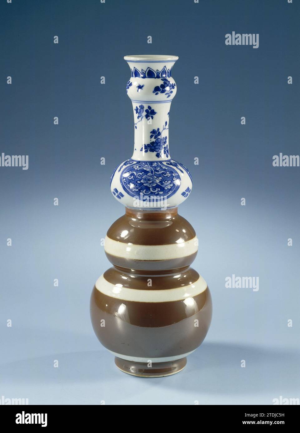 Triple gourd-shaped bottle with brown glaze and flower scrolls ...