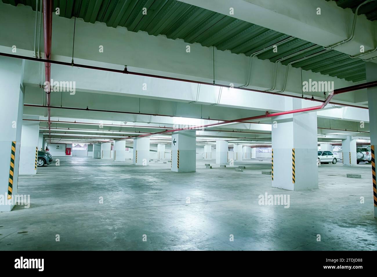 car parking area in the basement of a building Stock Photo - Alamy
