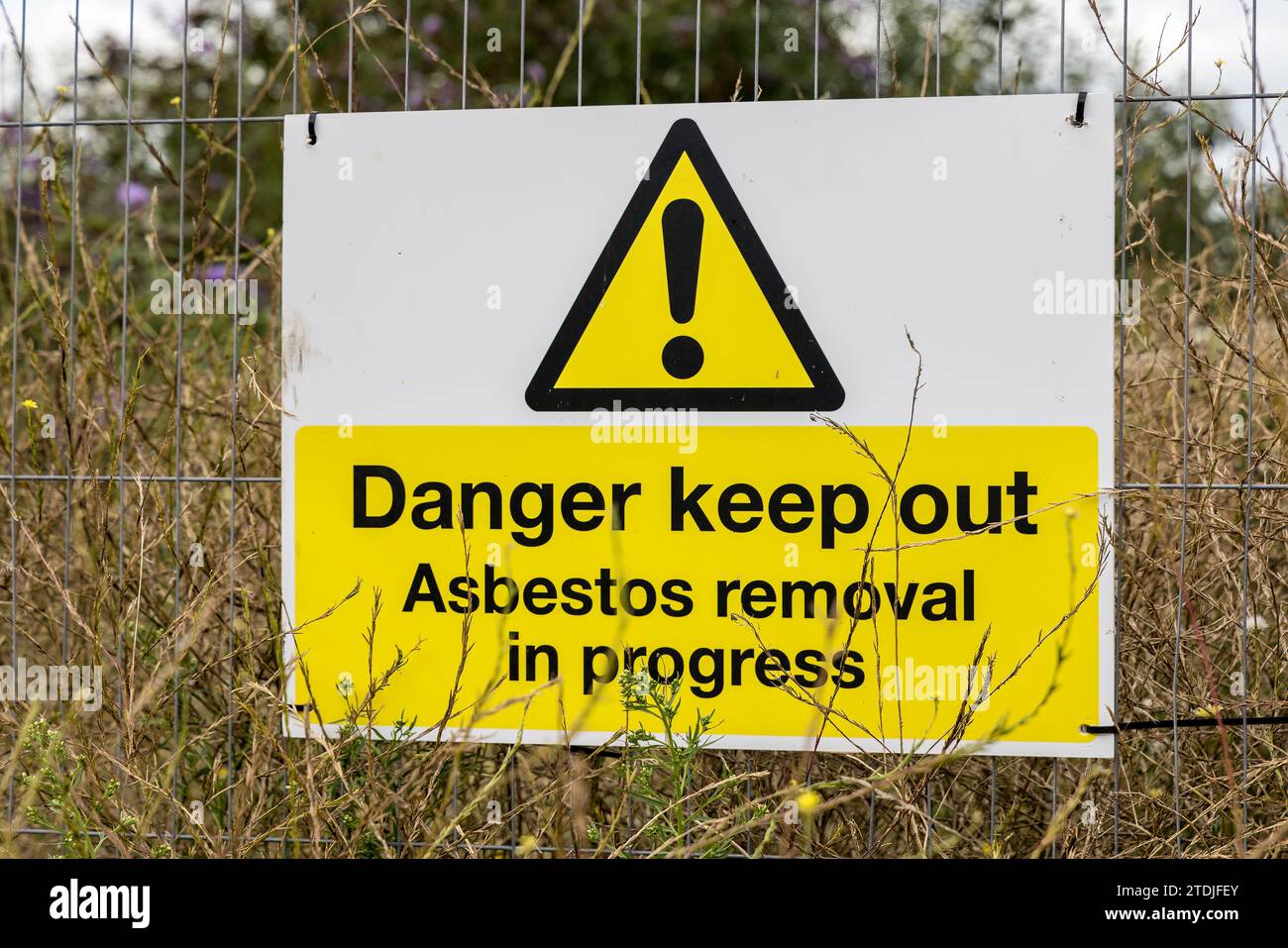 Danger sign for asbestos removal, Barry, Wales, UK Stock Photo - Alamy