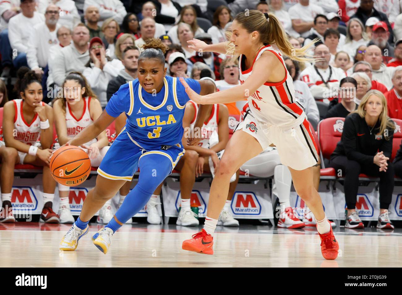 UCLA's Londynn Jones, left, drives to the basket against Ohio State's ...