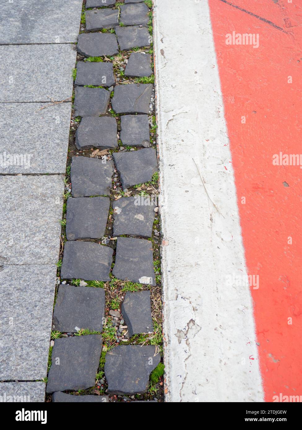 Border between running track and street paving stones. Treadmill ...