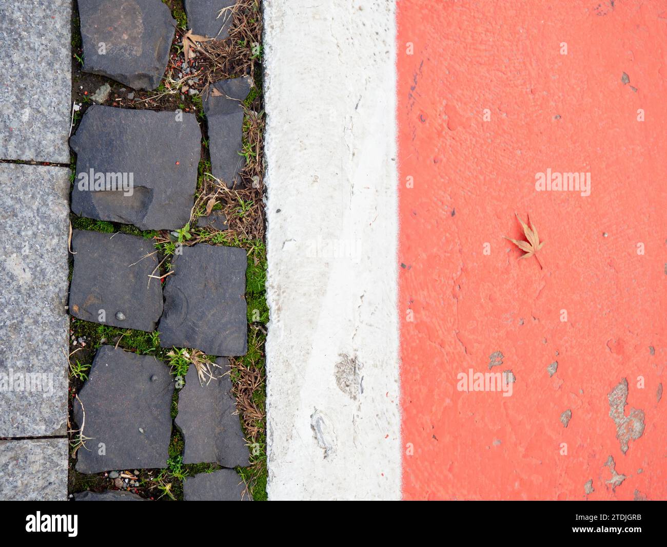 Border between running track and street paving stones. Treadmill ...