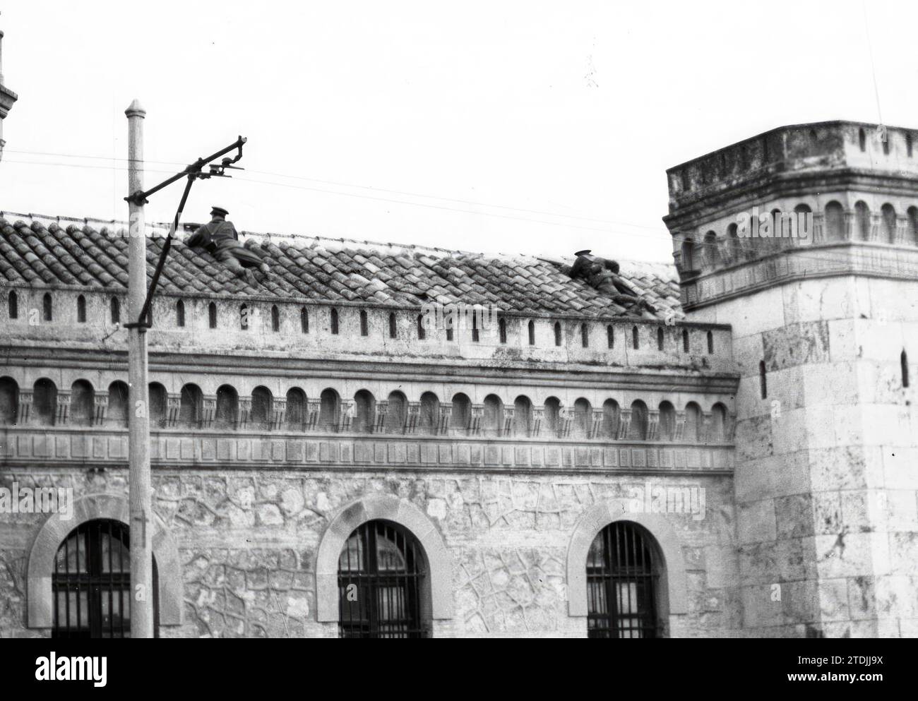 12/31/1936. The Soldiers from the Rooftops of the Prison Firing at the ...