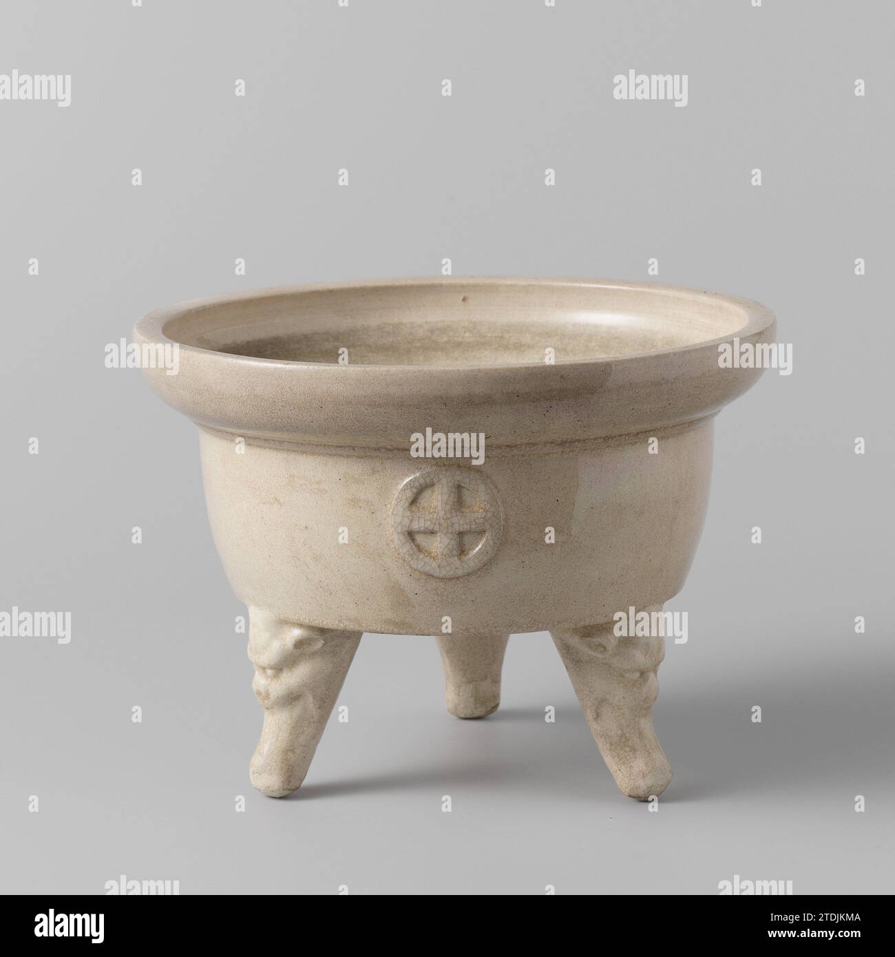 Bowl on three legs with animal heads and a mon (family emblem ...