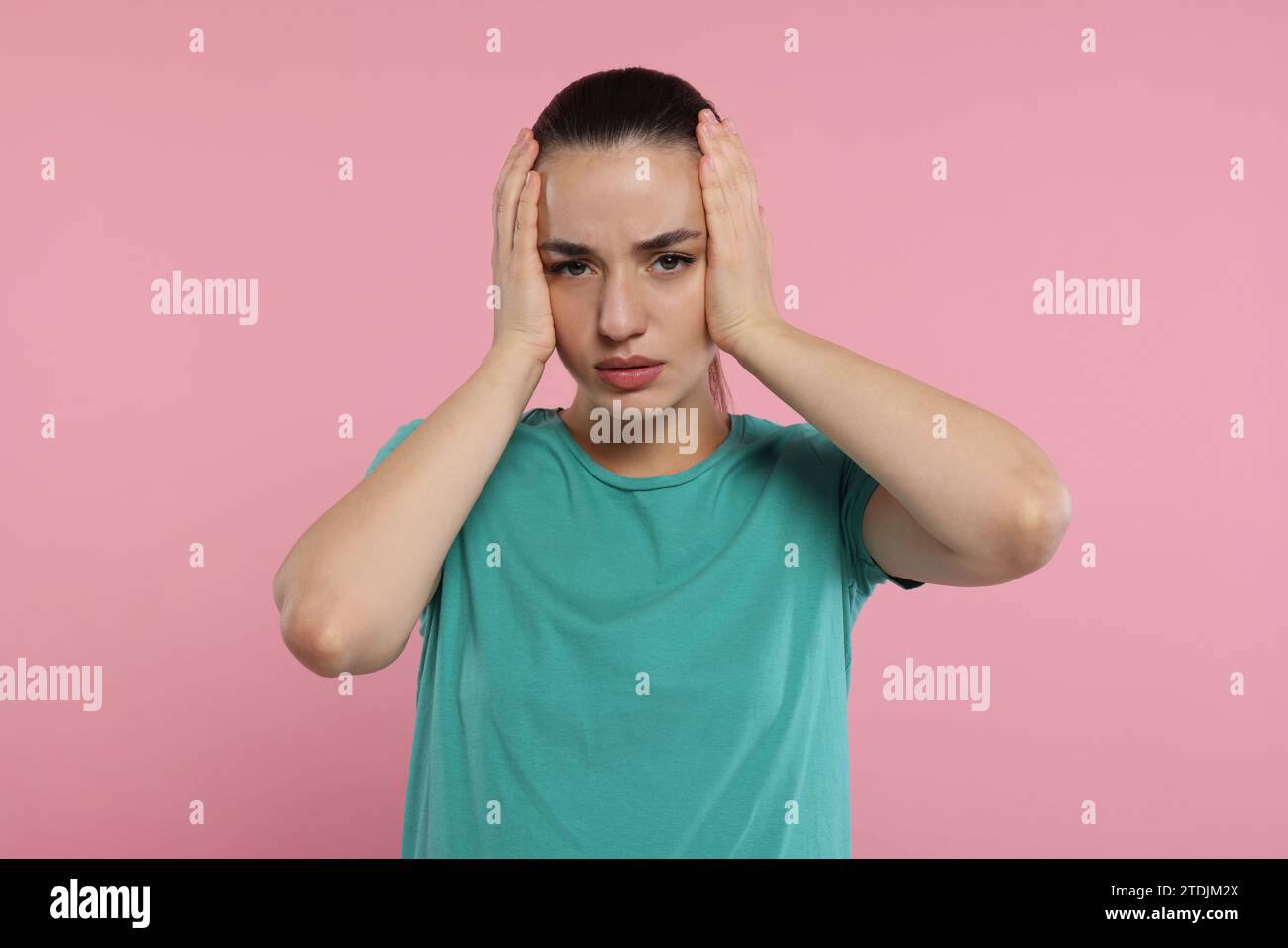 Resentment. Portrait of upset woman on pink background Stock Photo - Alamy