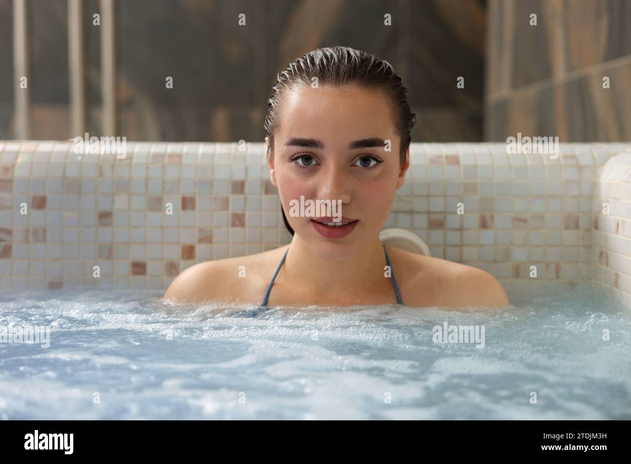 Pretty woman in jacuzzi spa hi-res stock photography and images - Alamy