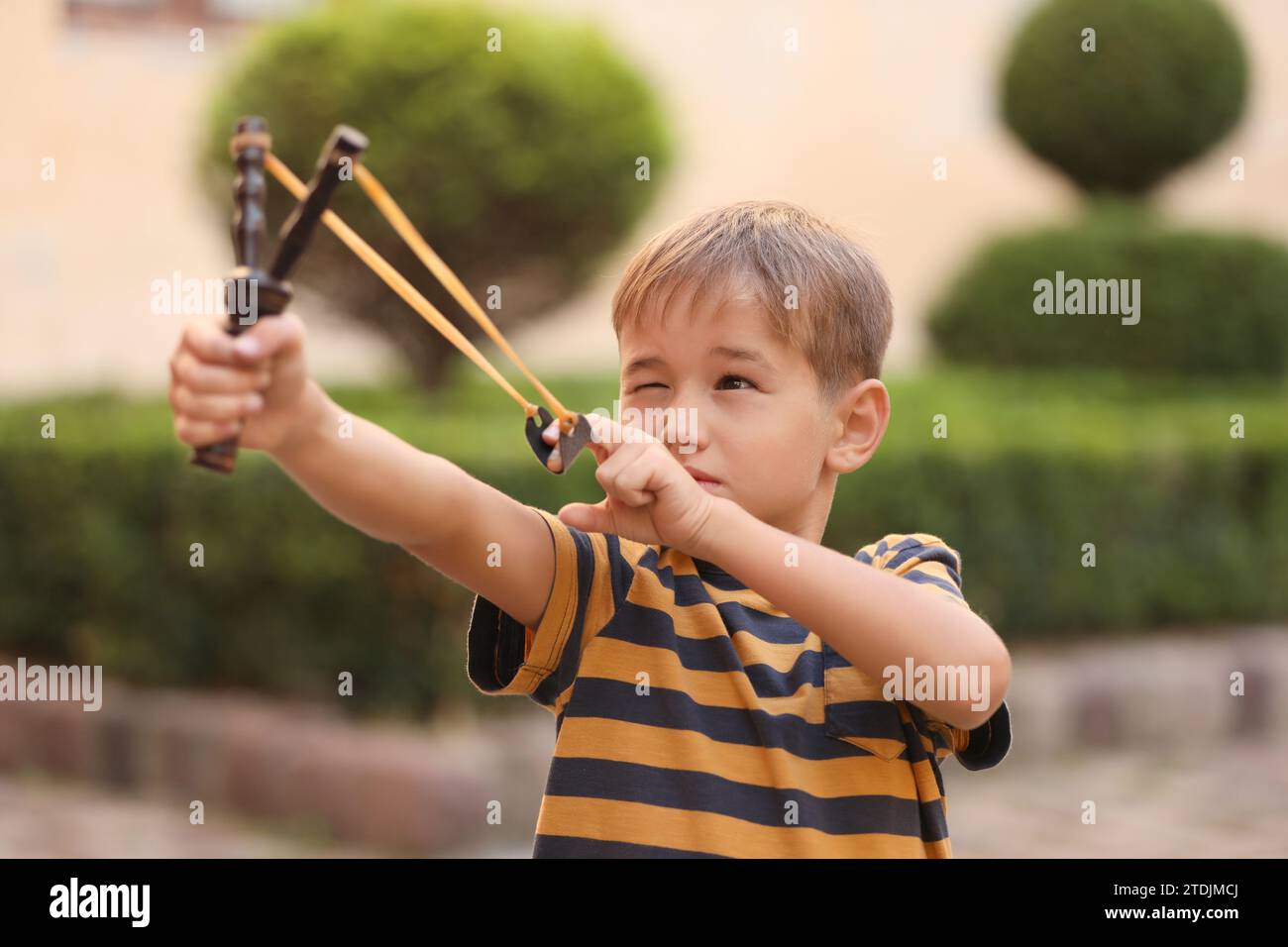 Boy with catapult hi-res stock photography and images - Alamy