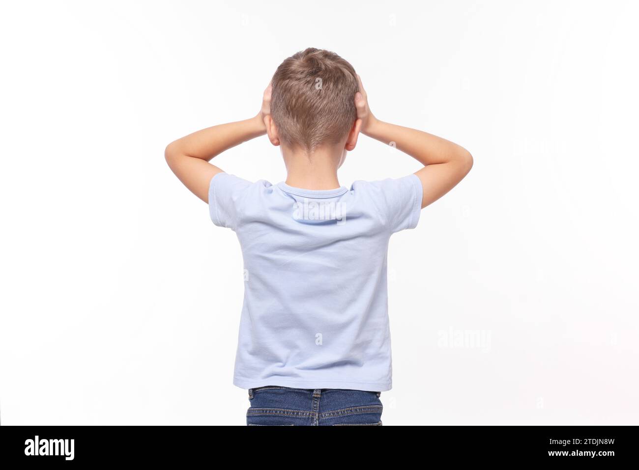 Dyslexia problem. Boy covering head with hands on white background ...