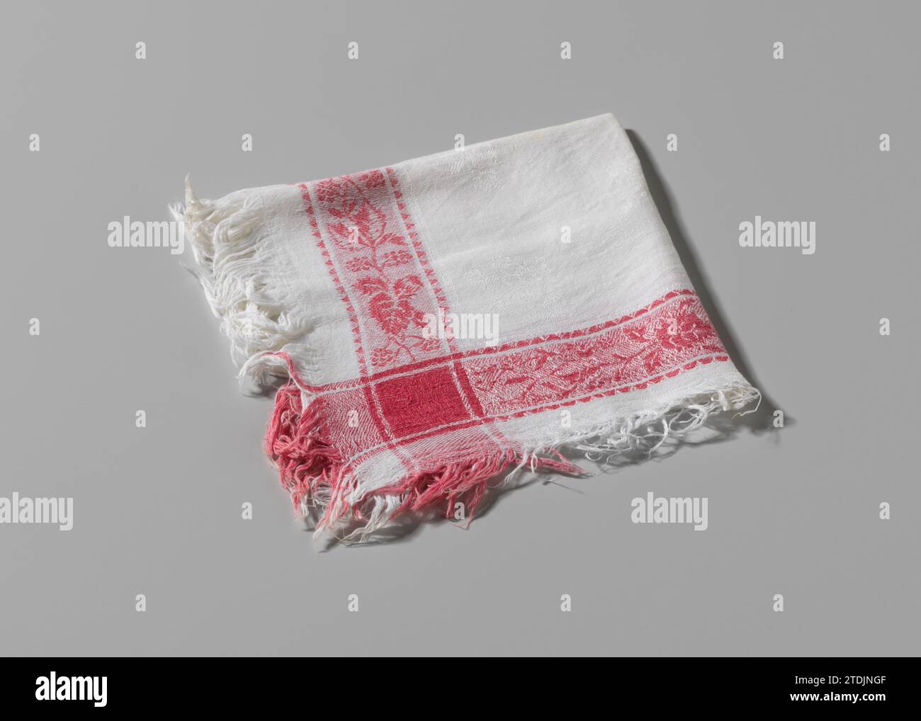 Fingerchapp of cotton damask with rose pattern and trimmed with a red ...