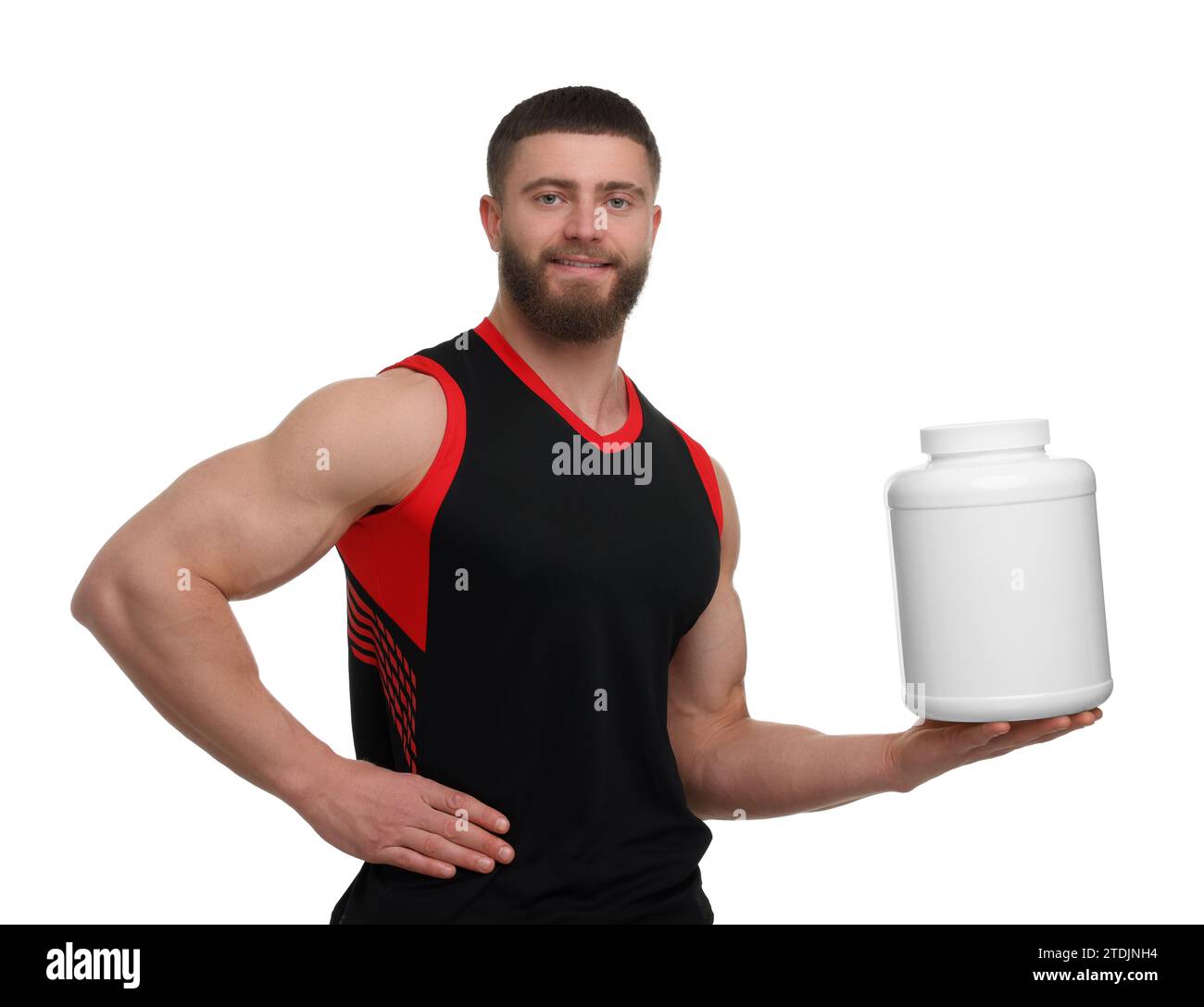 Young man with muscular body holding jar of protein powder on white ...