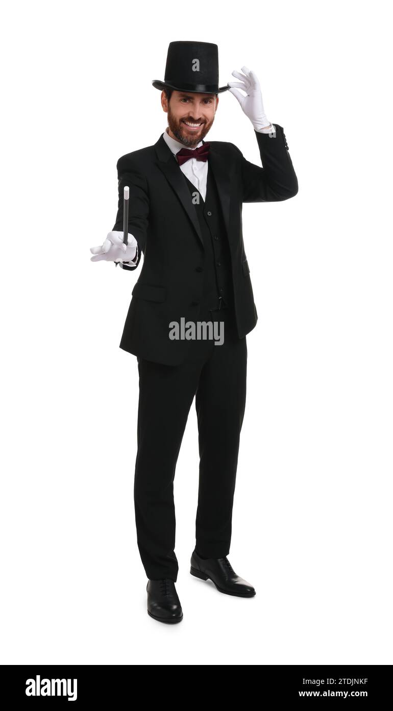 Happy magician in top hat holding wand on white background Stock Photo ...