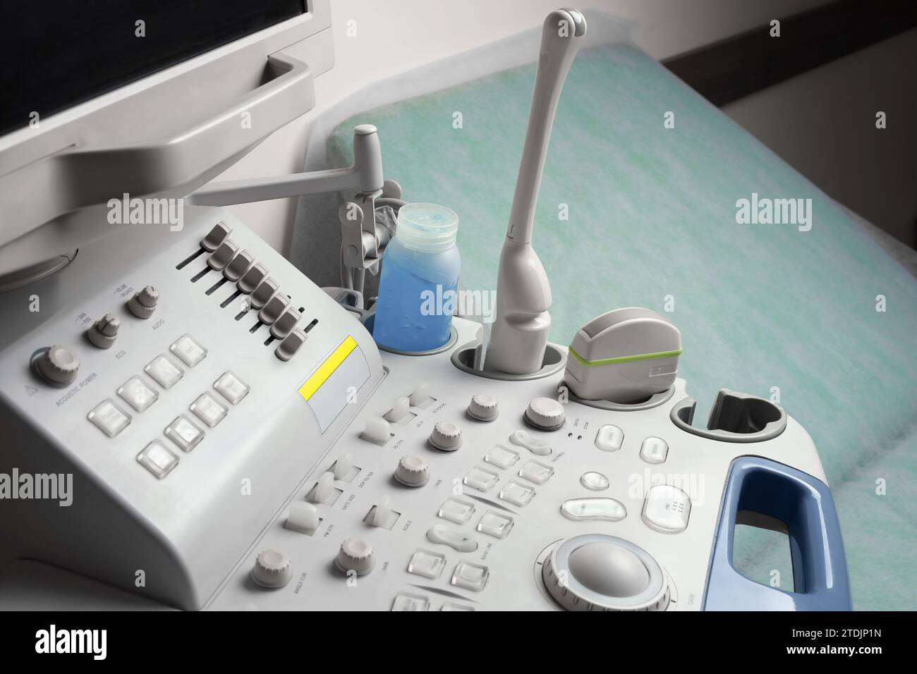 Ultrasound control panel and examination table in hospital, closeup ...