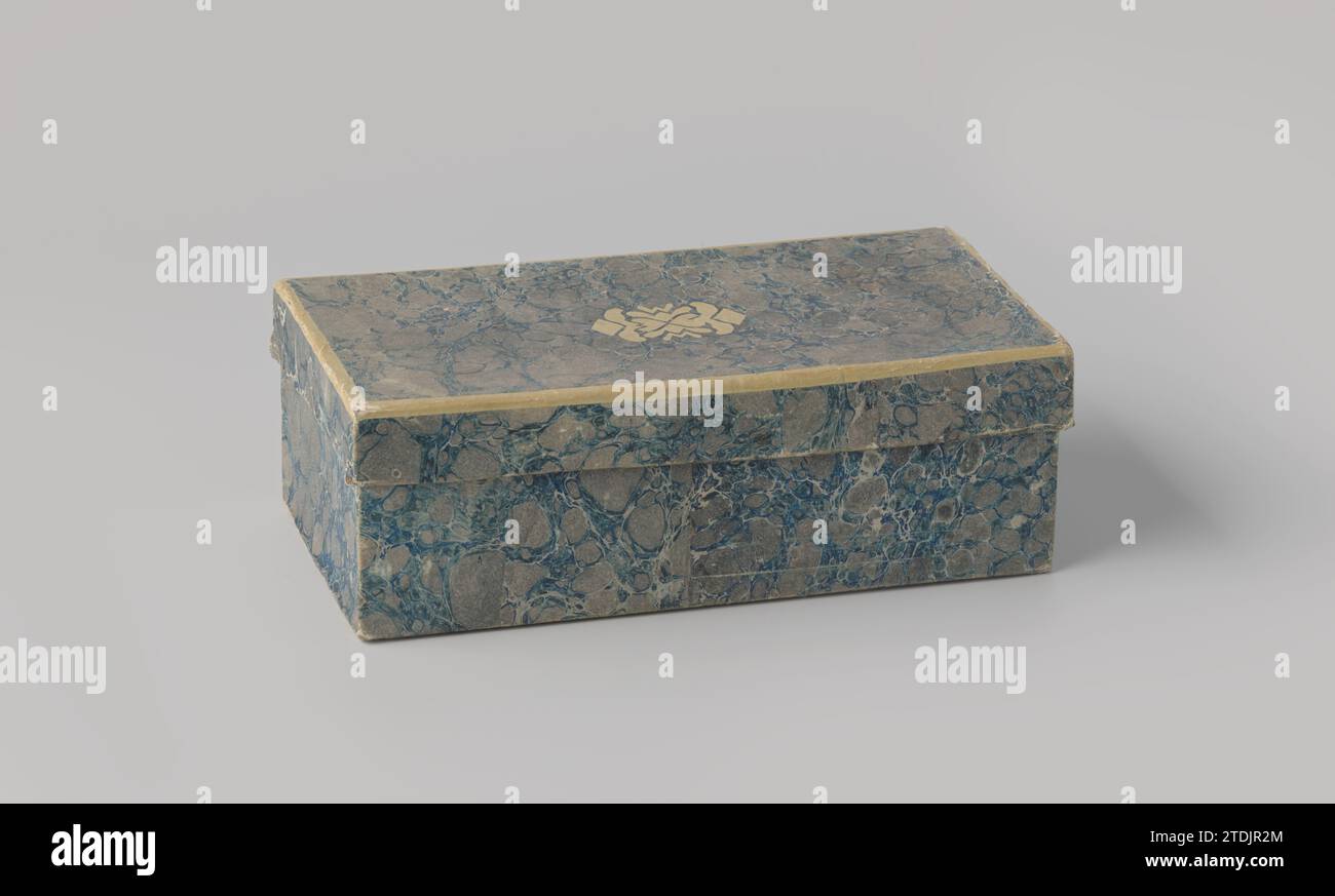 Box of cardboard covered with blue marble paper, in which a pattern is ...