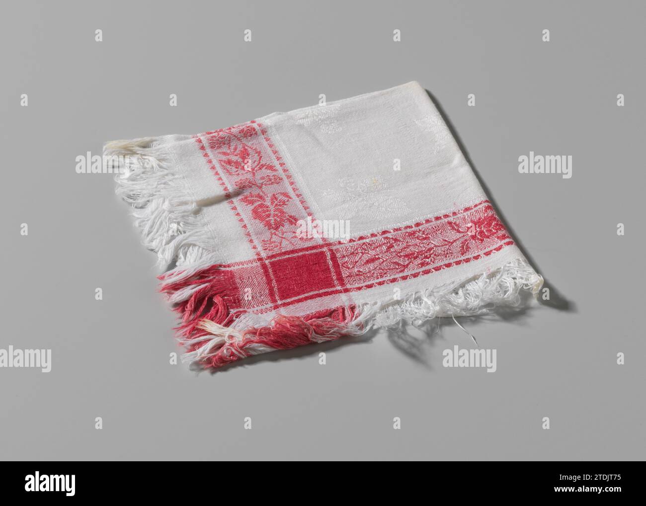 Cotton damask finger cloth with rose pattern and trimmed with a red ...