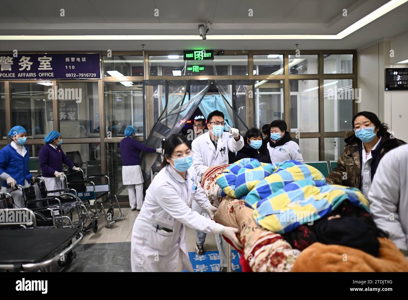 Haidong, China. 19 December, 2023. A person injured in an earthquake ...