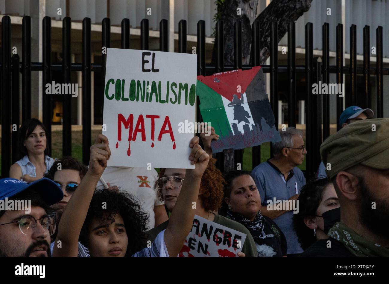 San Juan, USA. 18th Dec, 2023. An activist holds a sign that reads ...