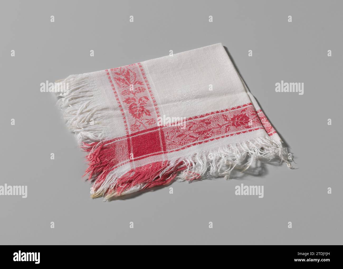 Cotton damask finger cloth with rose pattern and trimmed with a red ...