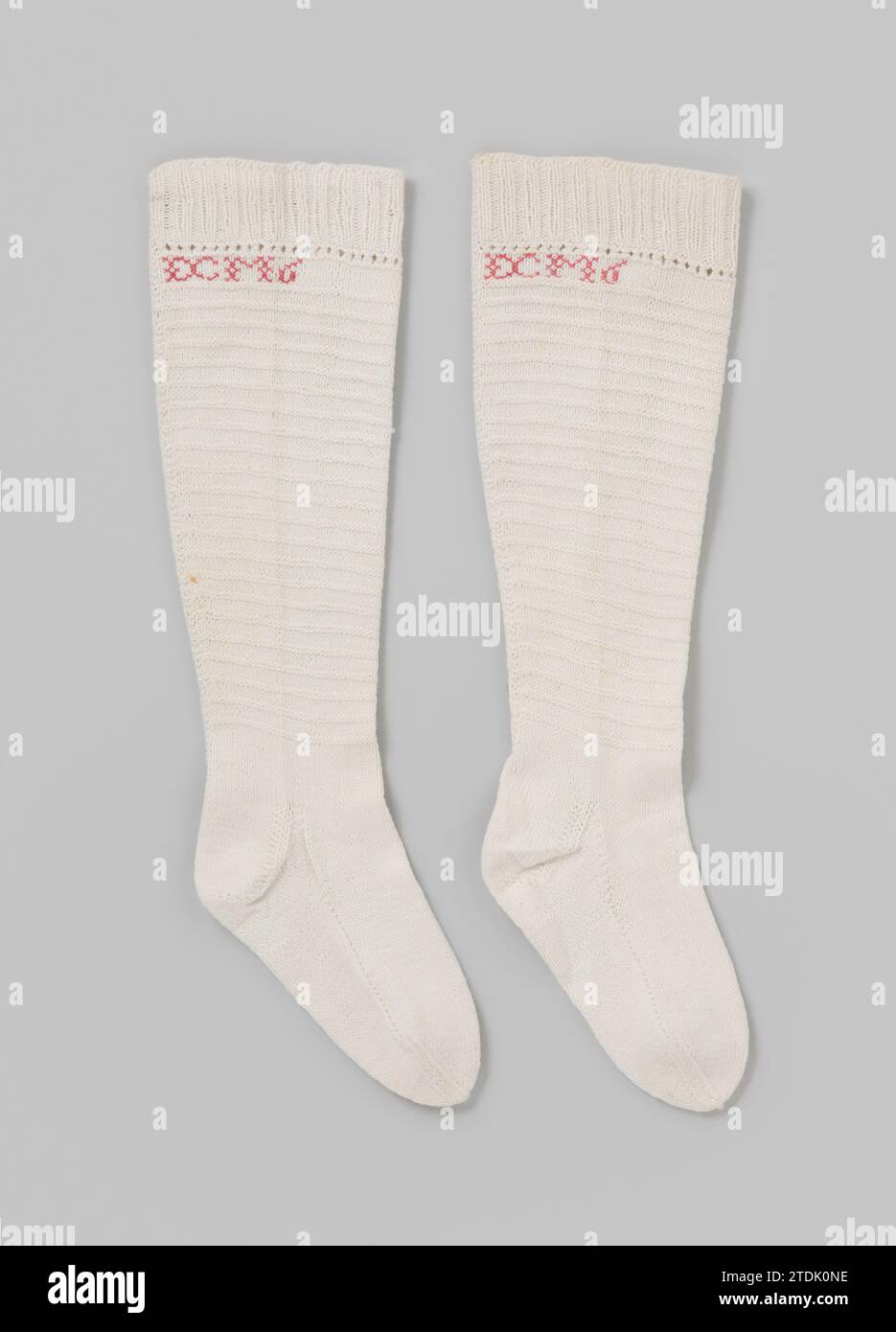 White cotton stocking knitted in horizontal ridges, with narrow border ...