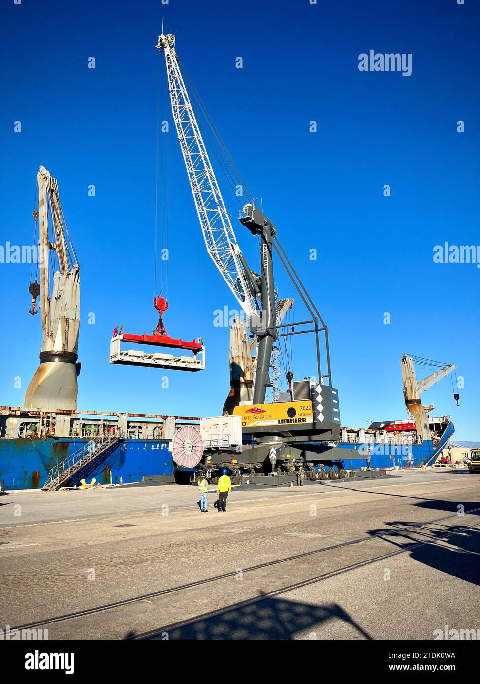 Precast concrete foundations are loaded onto the Military Sealift ...