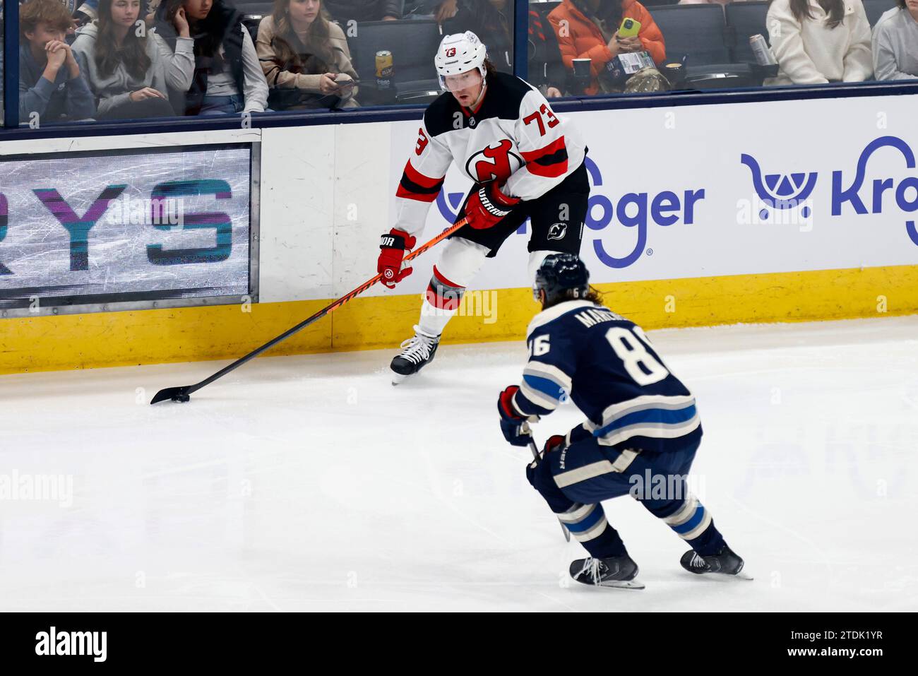 New Jersey Devils forward Tyler Toffoli, left, controls the puck in ...