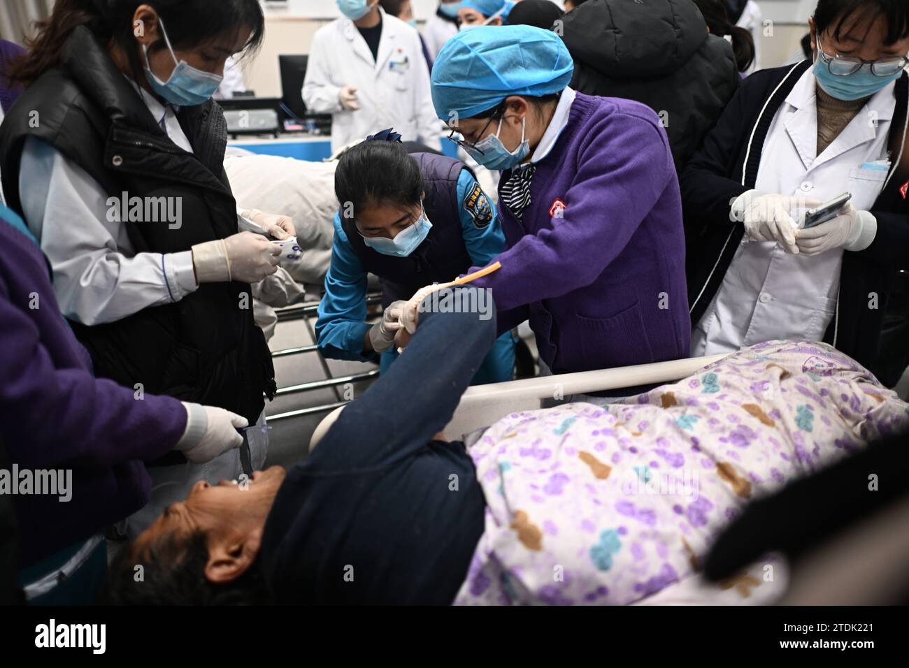 Minhe, China. 19 December, 2023. A person injured in an earthquake ...