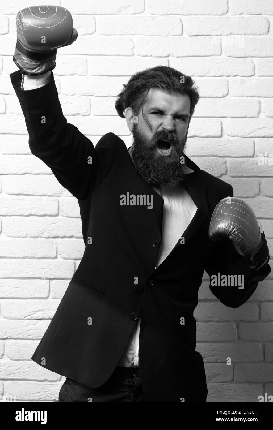 Hard business. Funny excited businessman in boxing gloves. Crazy man ...