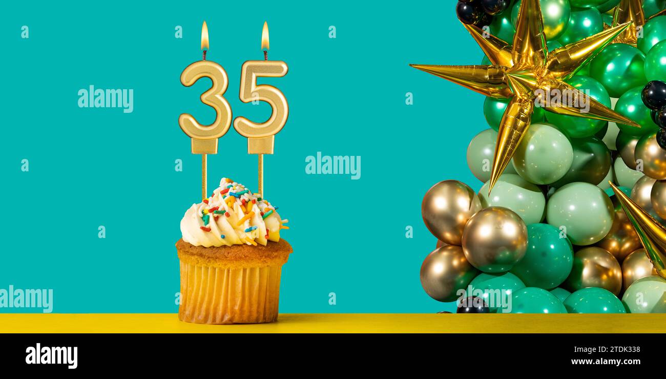 Birthday card number 35 - Cupcake with balloons Stock Photo - Alamy