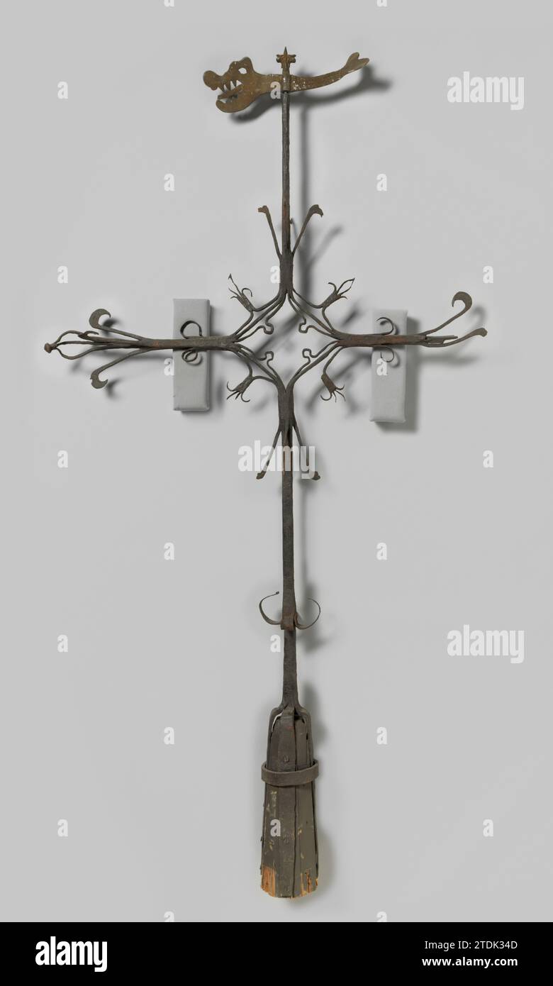 Tower cross whose cross arms end in lilies. Wind vane in form of sea ...