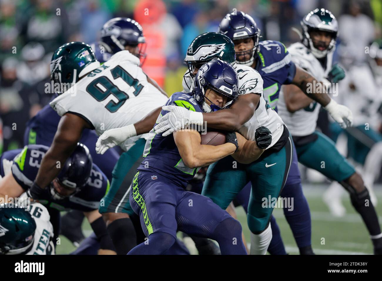 Seattle Seahawks running back Zach Charbonnet (26) is stopped by ...