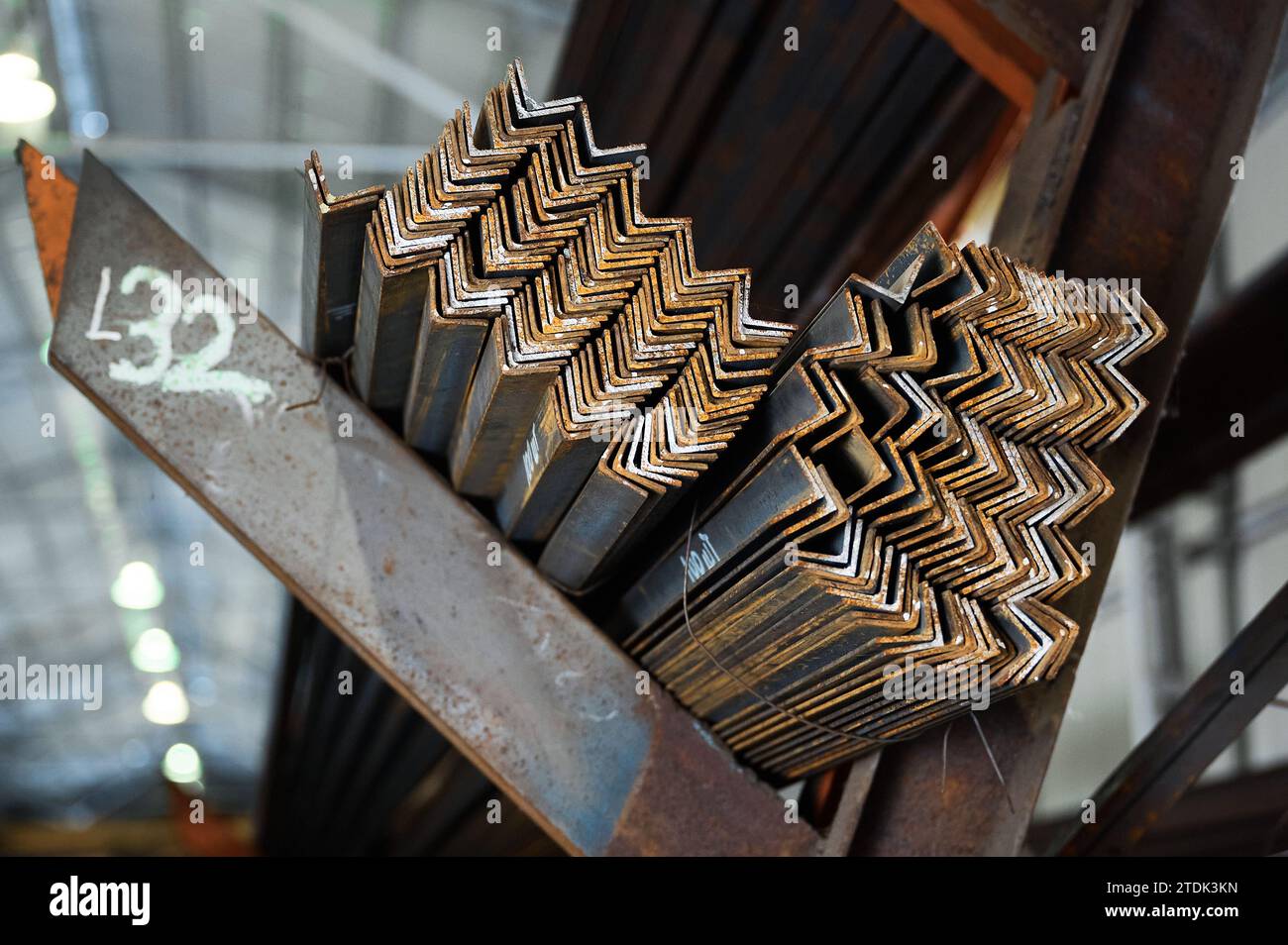 Equal angle steel stacks on shelving unit in cold warehouse Stock Photo ...