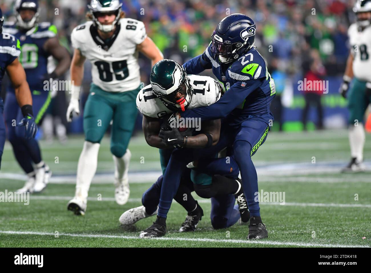 December 18, 2023: Seattle Seahawks cornerback Riq Woolen (27) stops Philadelphia Eagles wide ...