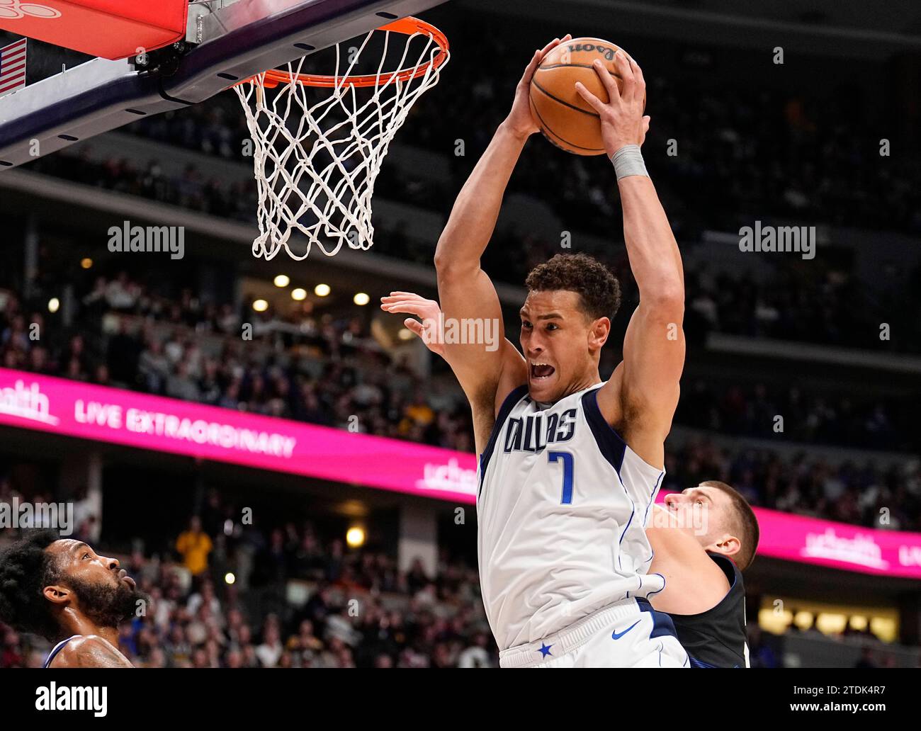 Dallas Mavericks center Dwight Powell (7) grabs a rebound against ...