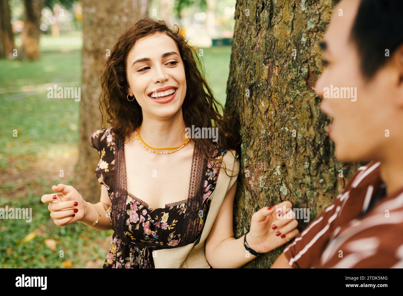 Happy excited young woman flirting with boyfriend when they are ...