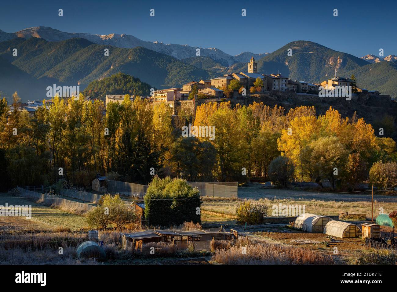 Hill and village of Bellver de Cerdanya on an autumn morning. In the ...