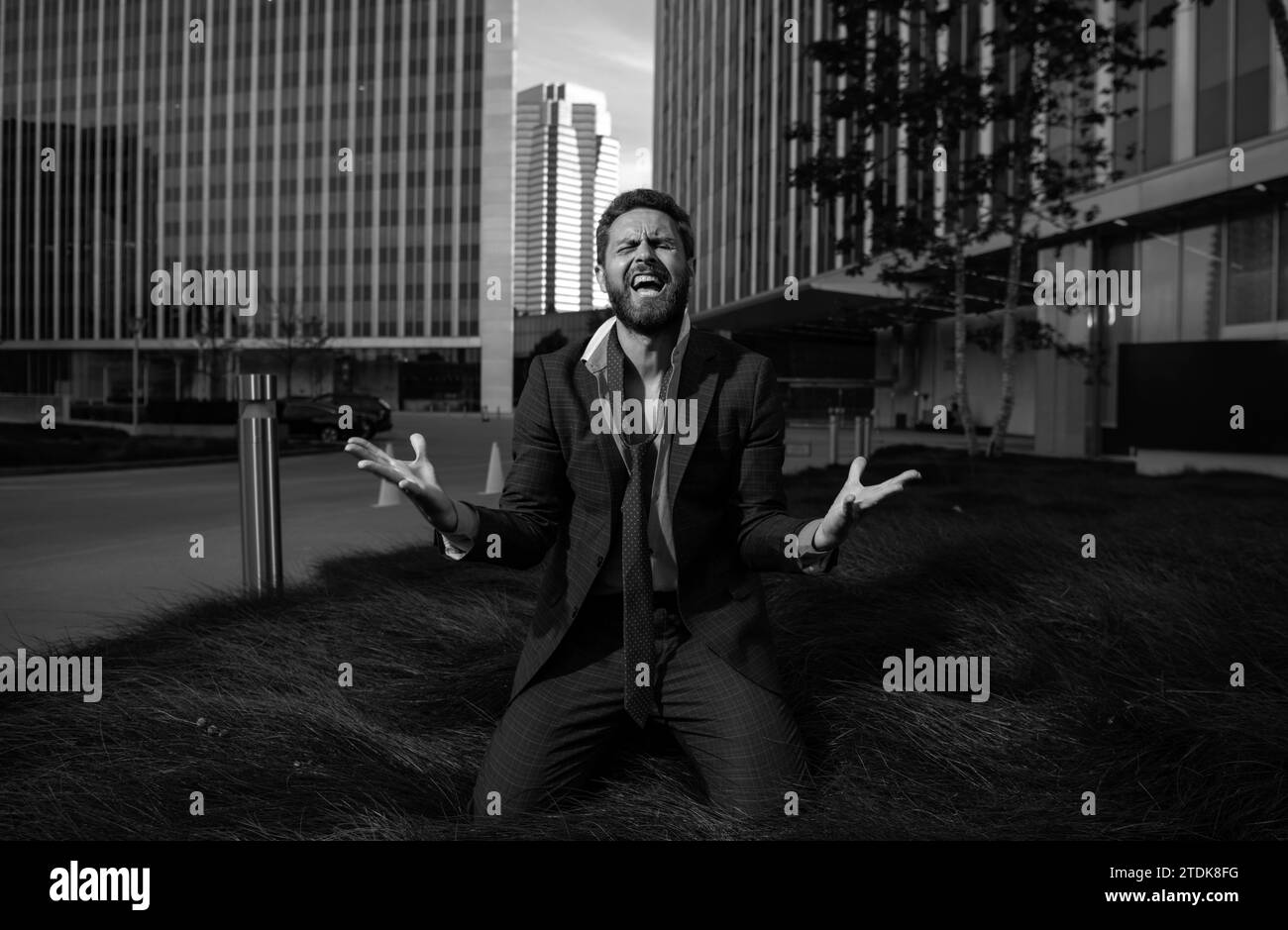 Business man crying in depression sitting on ground street suffering ...