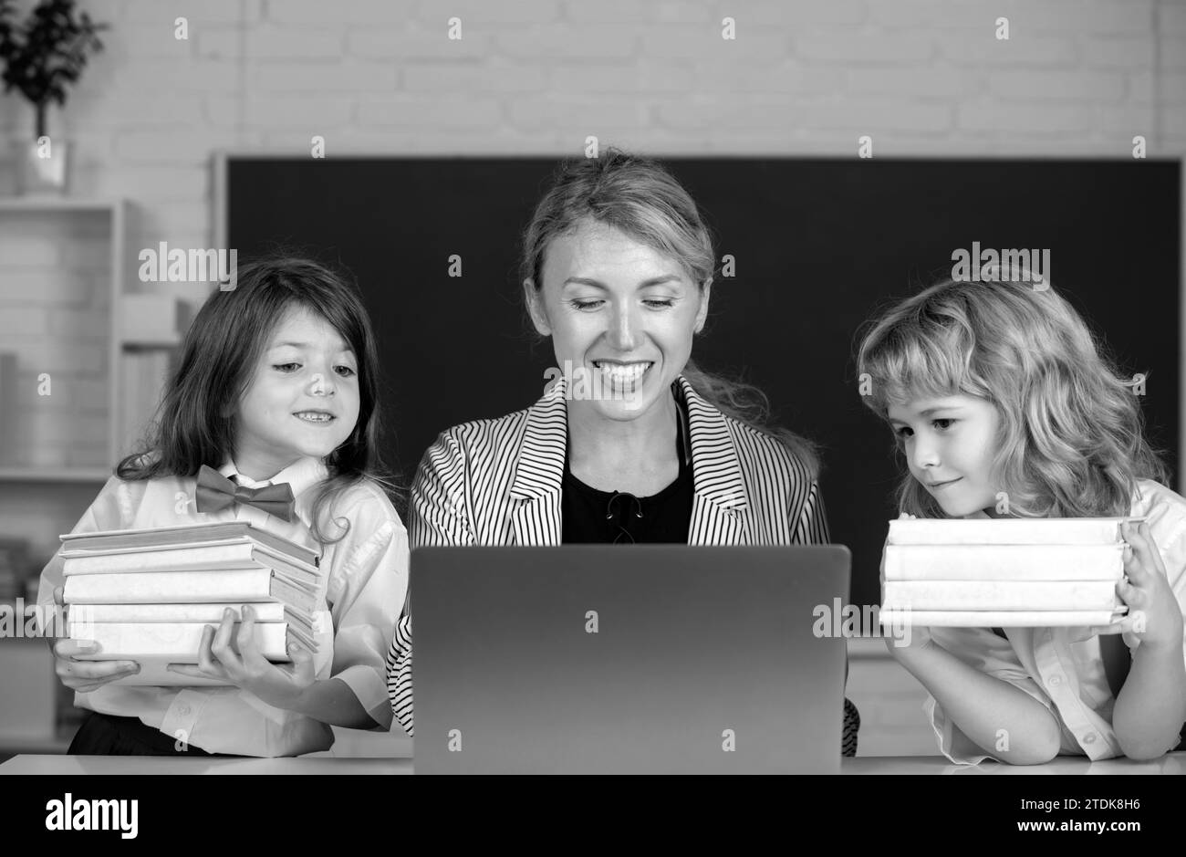 First day at school. Cute little boy from elementary school and tutor ...