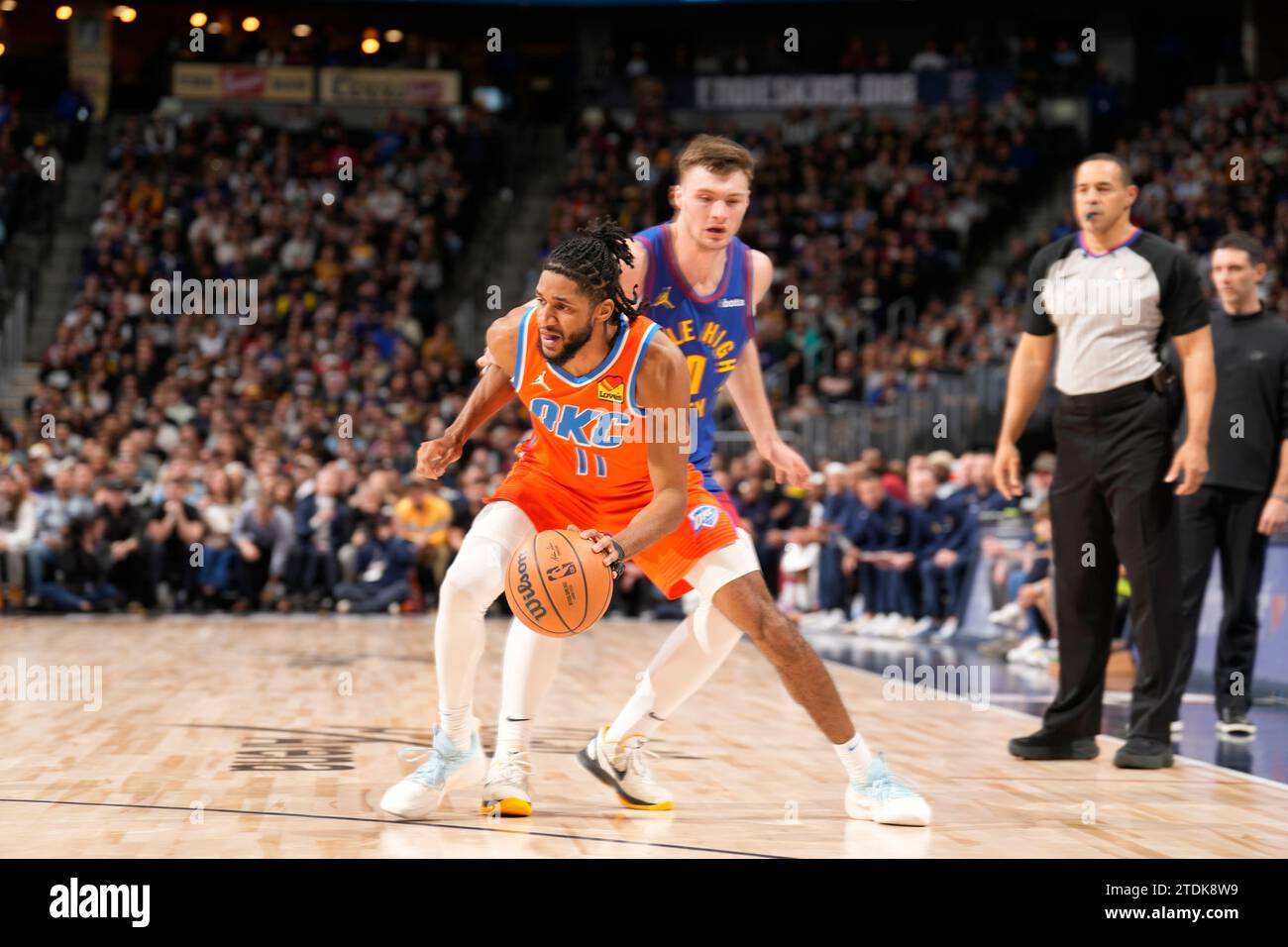 Oklahoma City Thunder guard Isaiah Joe (11) drives past Denver Nuggets ...