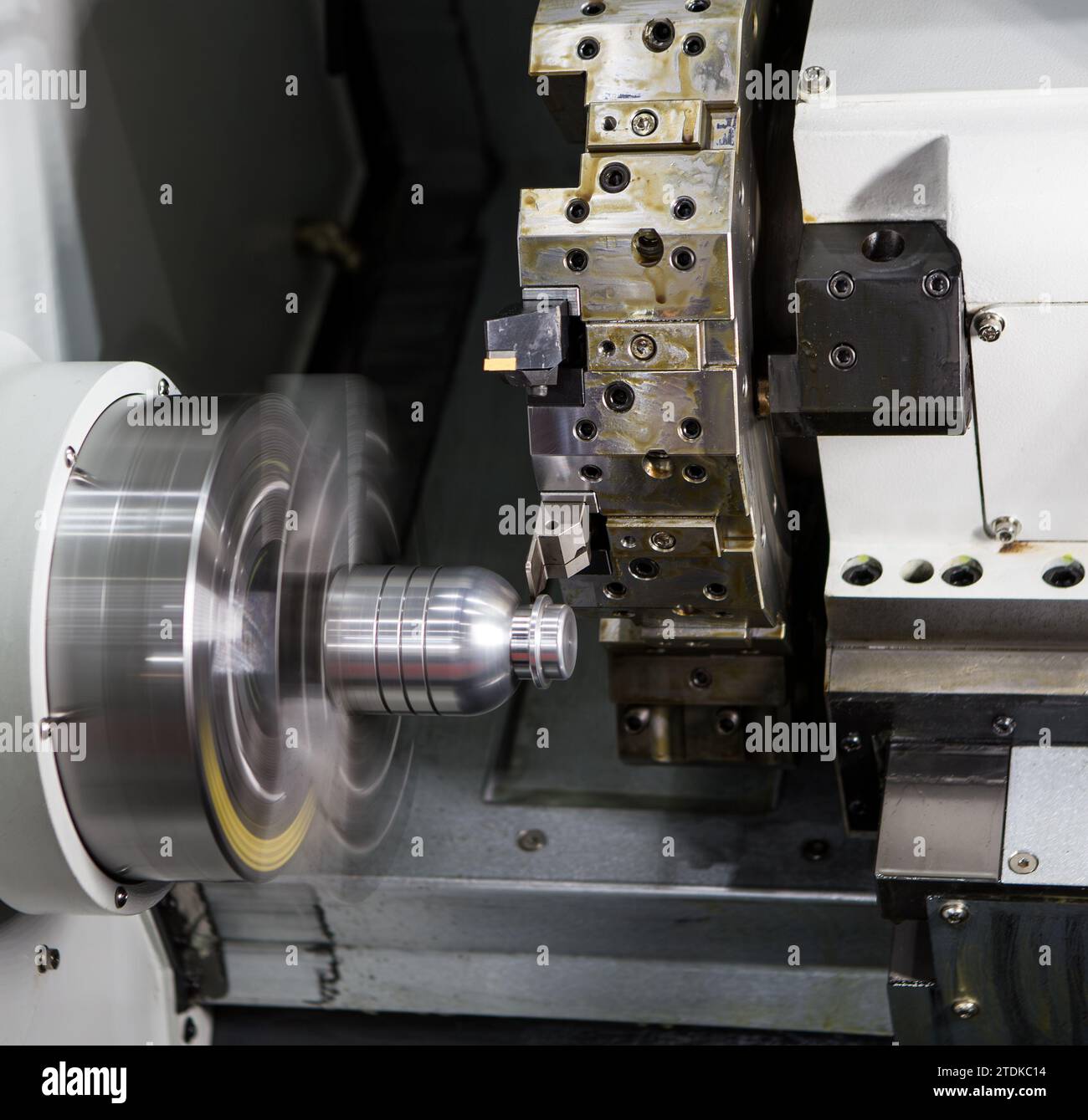 CNC Lathing machine cutting workpiece. Industrial manufacturing Stock Photo - Alamy