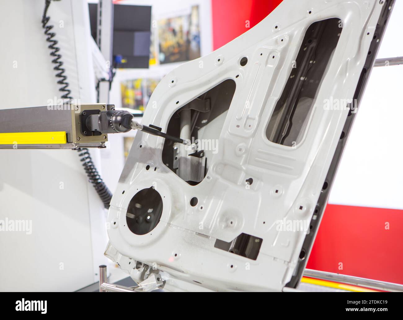 CMM Coordinate Measuring Machine probe inspecting car parts. Industrial ...