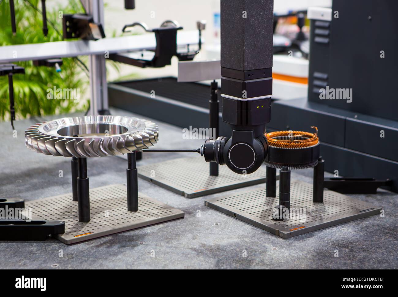 CMM Coordinate Measuring Machine probe inspecting car parts. Industrial ...