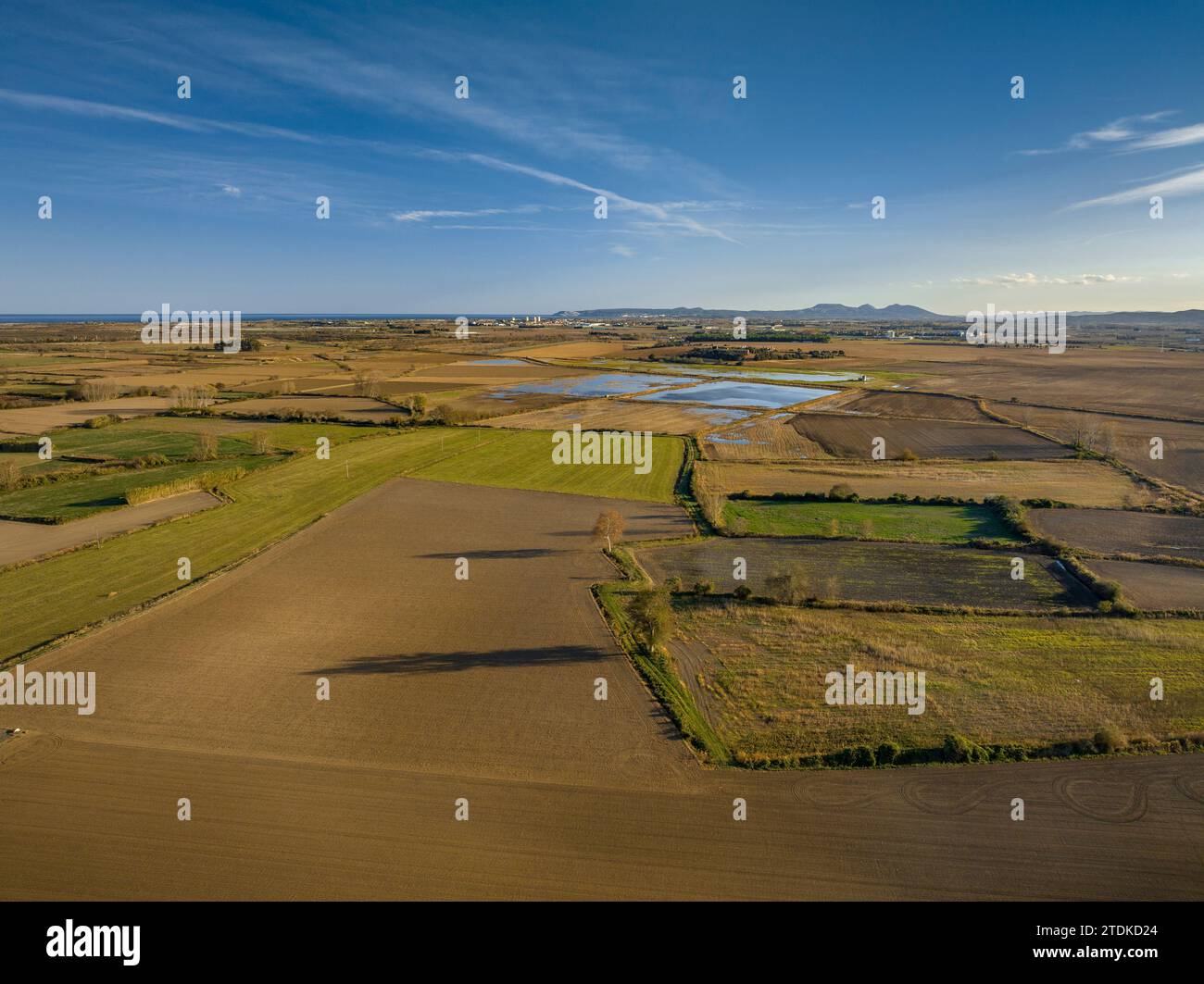 Aerial view of the village of Riumors and the fields and rural ...