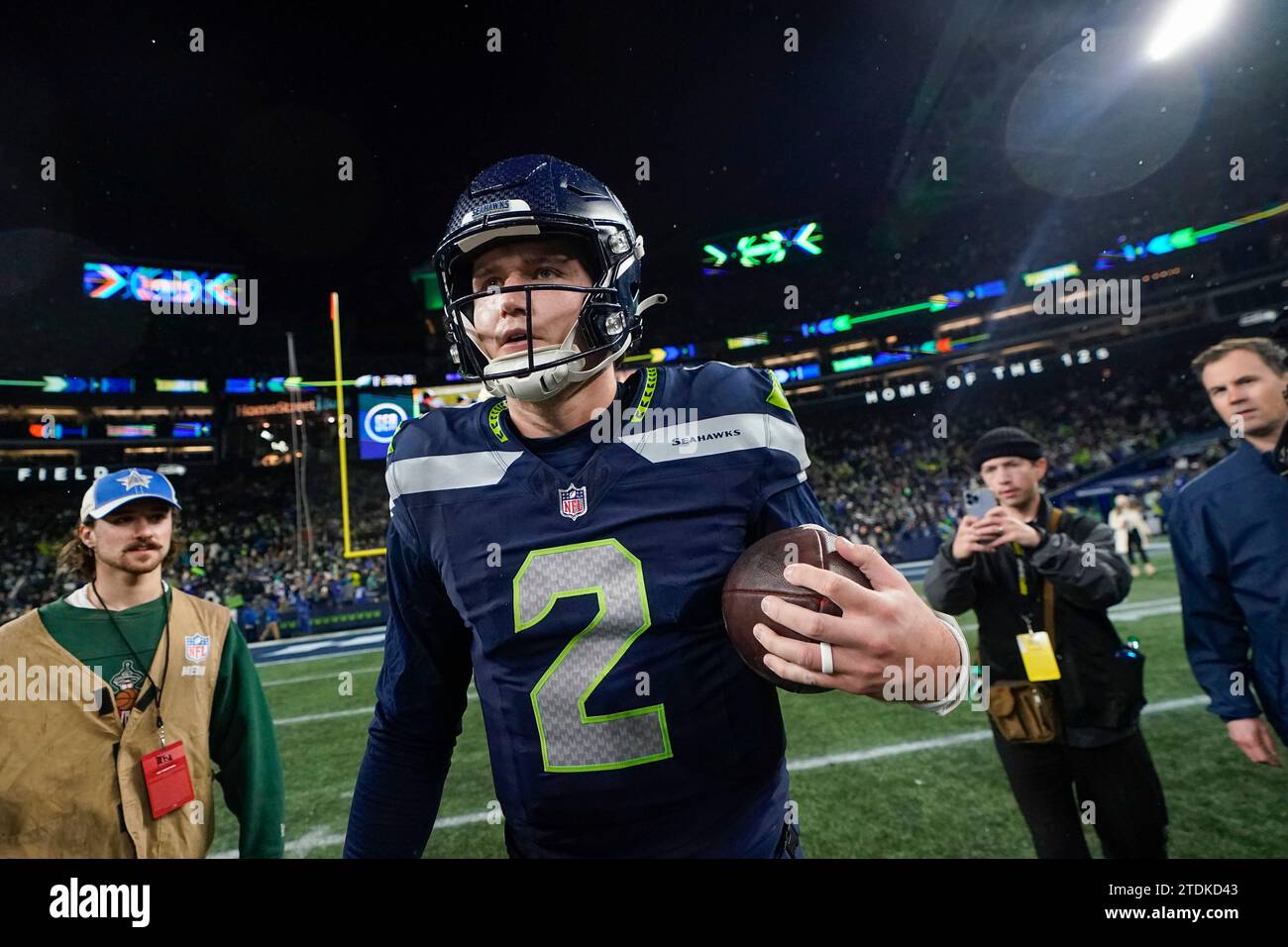Seattle Seahawks quarterback Drew Lock walks on the field following an ...