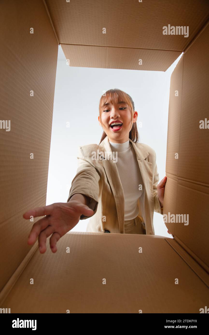 Unpacking the parcel, a girl with emotions unpacks the parcel, shot ...