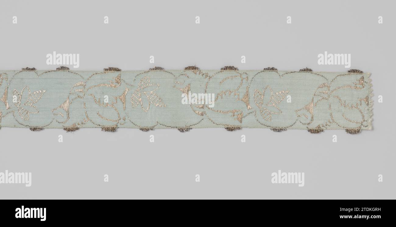 Ribbon of side brokaat in silver and blue; On a light blue surface, a ...