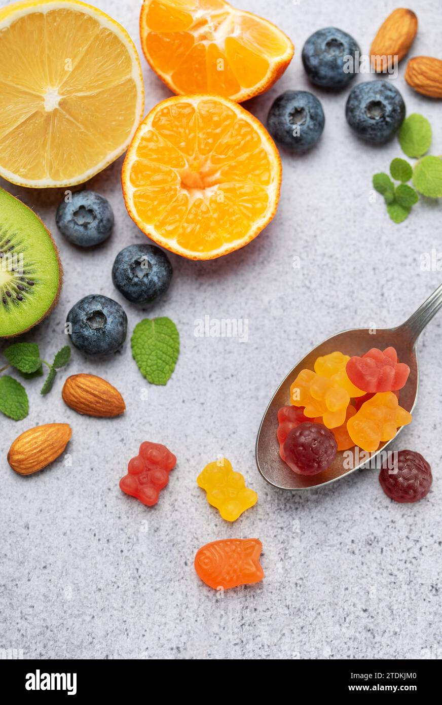 Chewable gummy bears vitamins and supplements and fresh fruits Stock ...