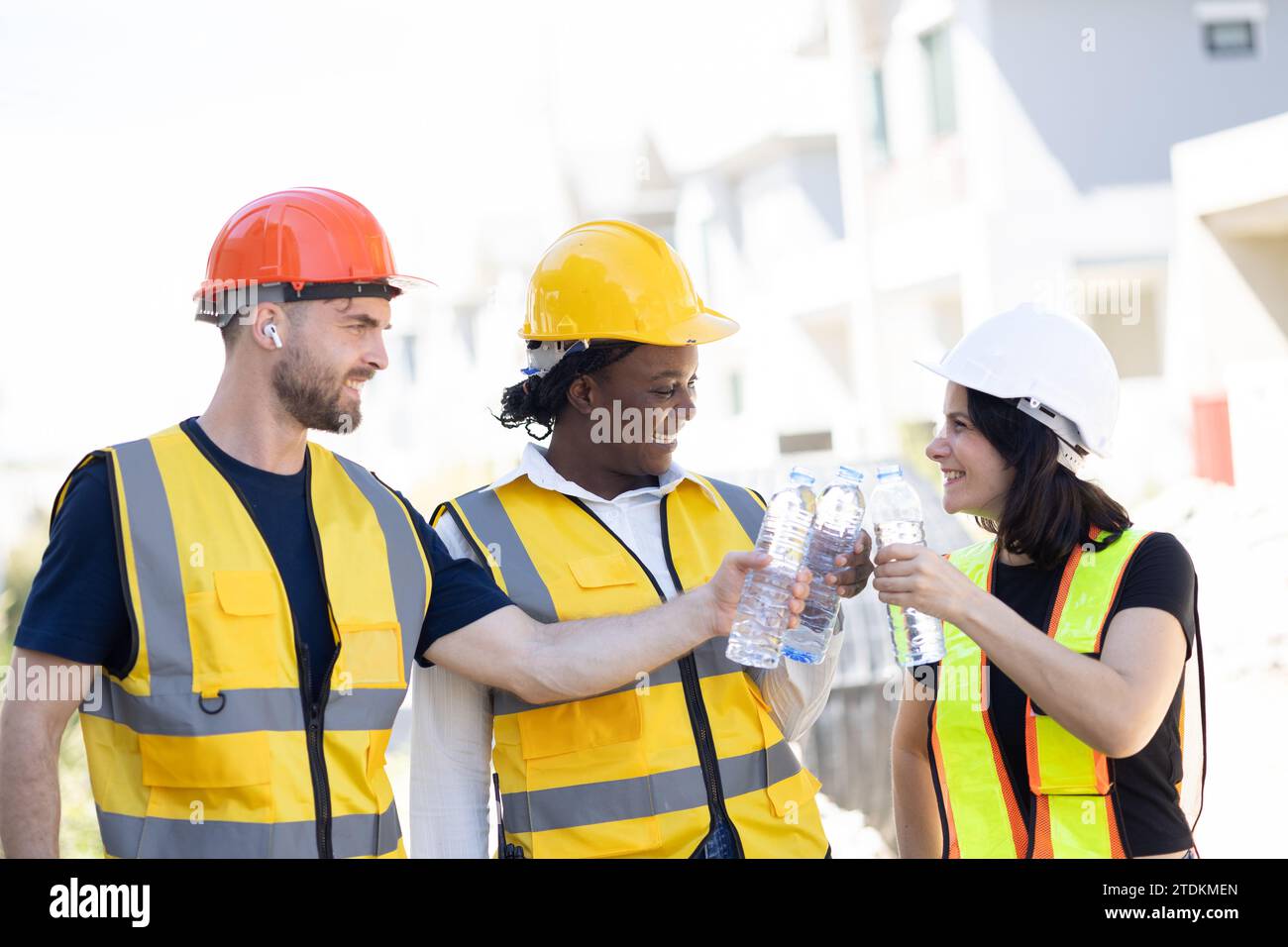 Healthy worker engineer team thirsty drinking clean water in hot temperature weather summer ...