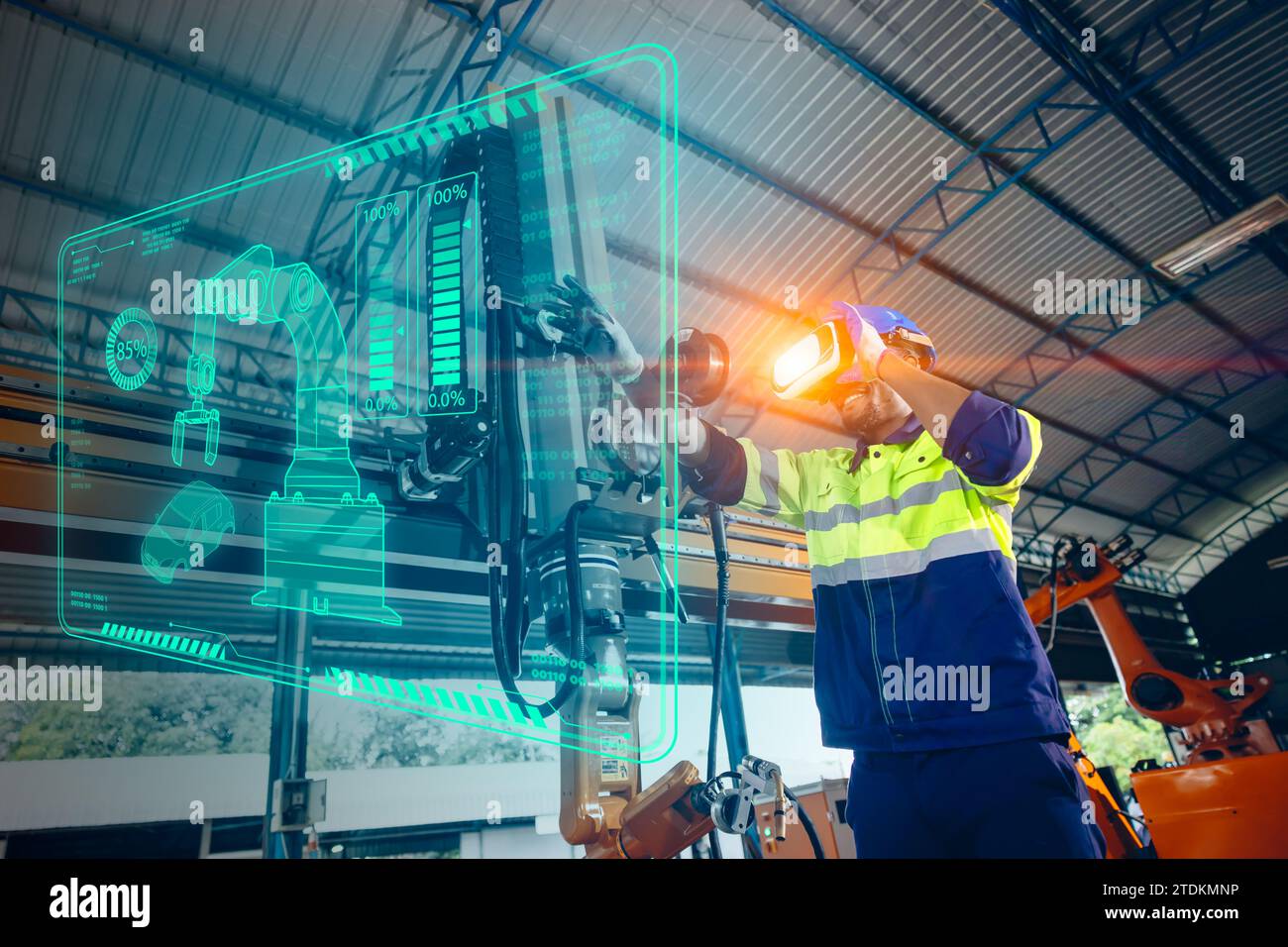 Engineer use VR virtual reality technology control operate robot machine in modern factory new ...